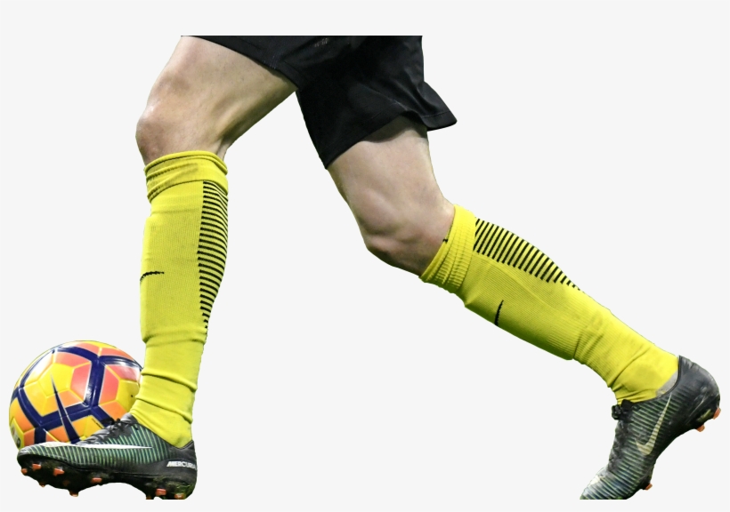 A Player Dribbling With The Soccer Ball At His Feet - Soccer Player Leg ...